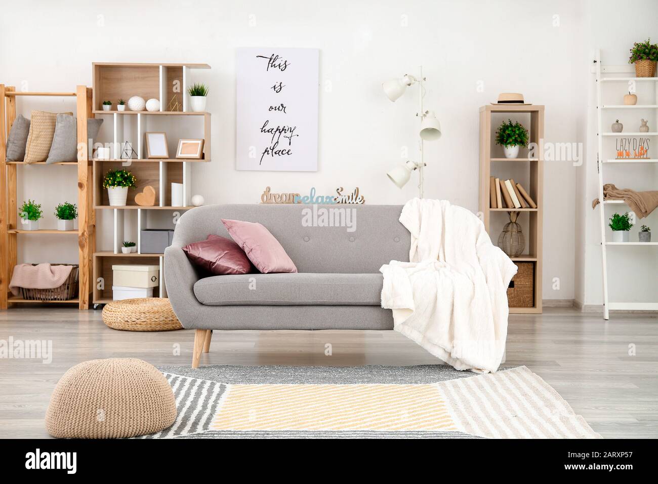Interior of modern room with comfortable sofa Stock Photo - Alamy
