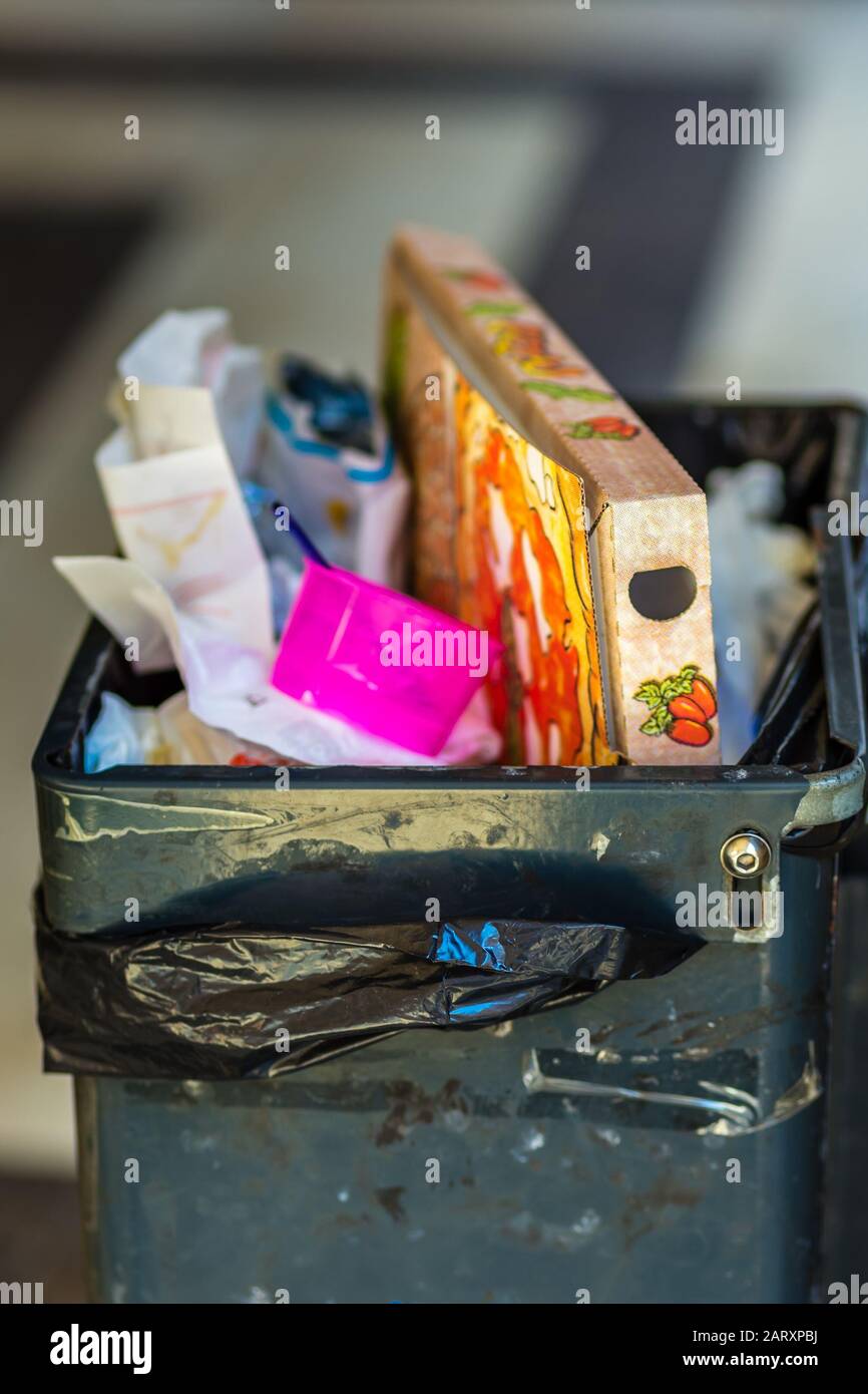 closeup of trash bin full of garbage Stock Photo - Alamy