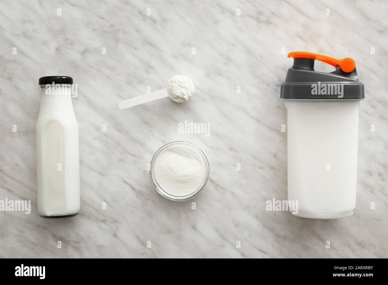 Bottles of protein shake on light background Stock Photo - Alamy