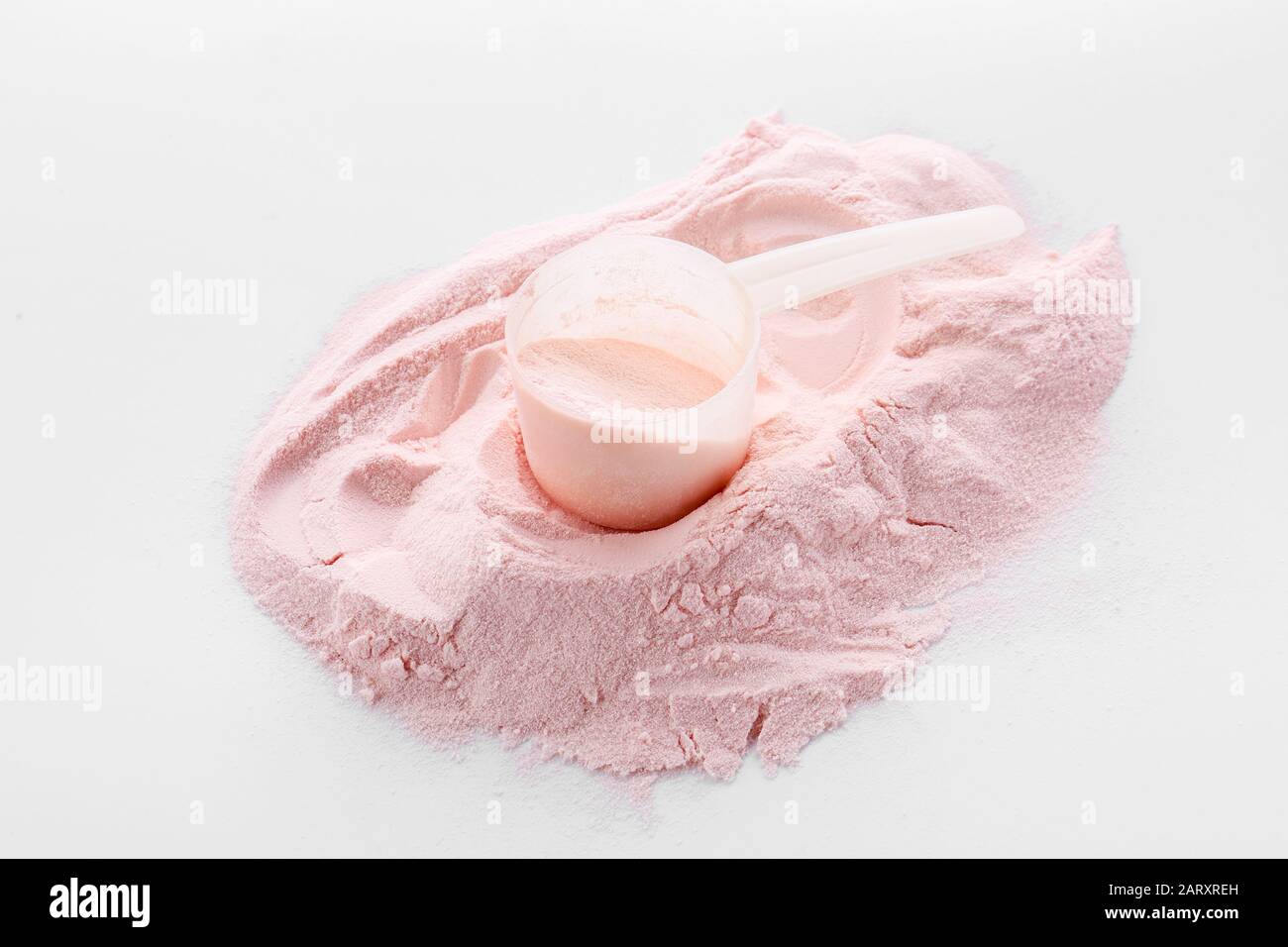 Protein powder on white background Stock Photo - Alamy