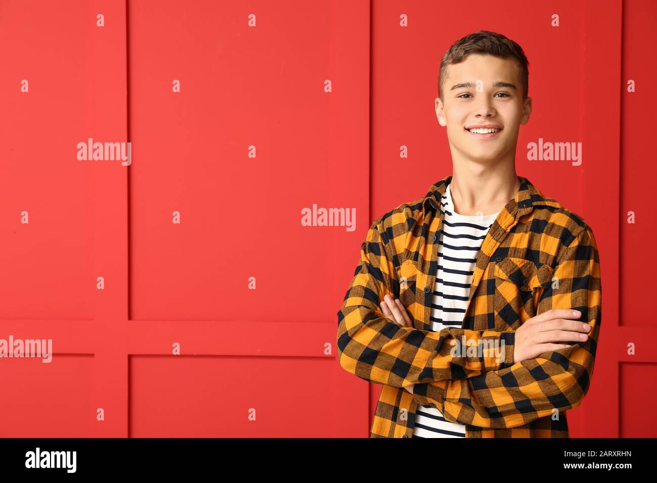 Cool teenage boy on color background Stock Photo - Alamy