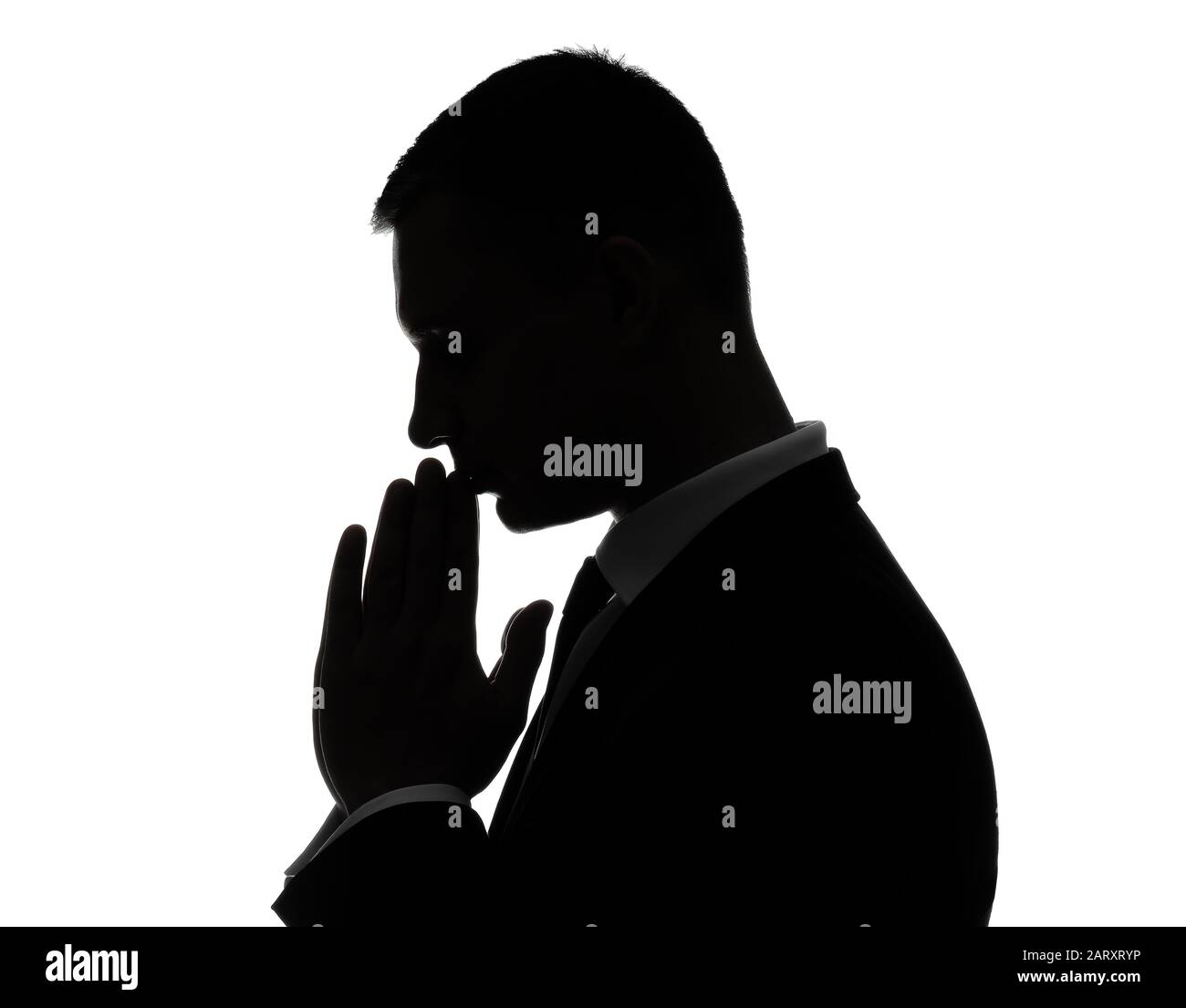 Silhouette of handsome praying businessman on white background Stock ...