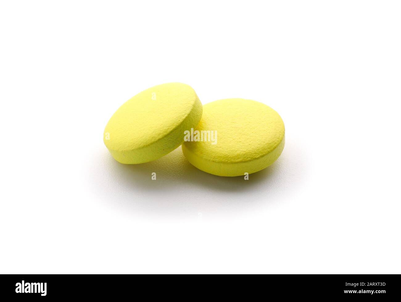 Color pills on white background Stock Photo - Alamy