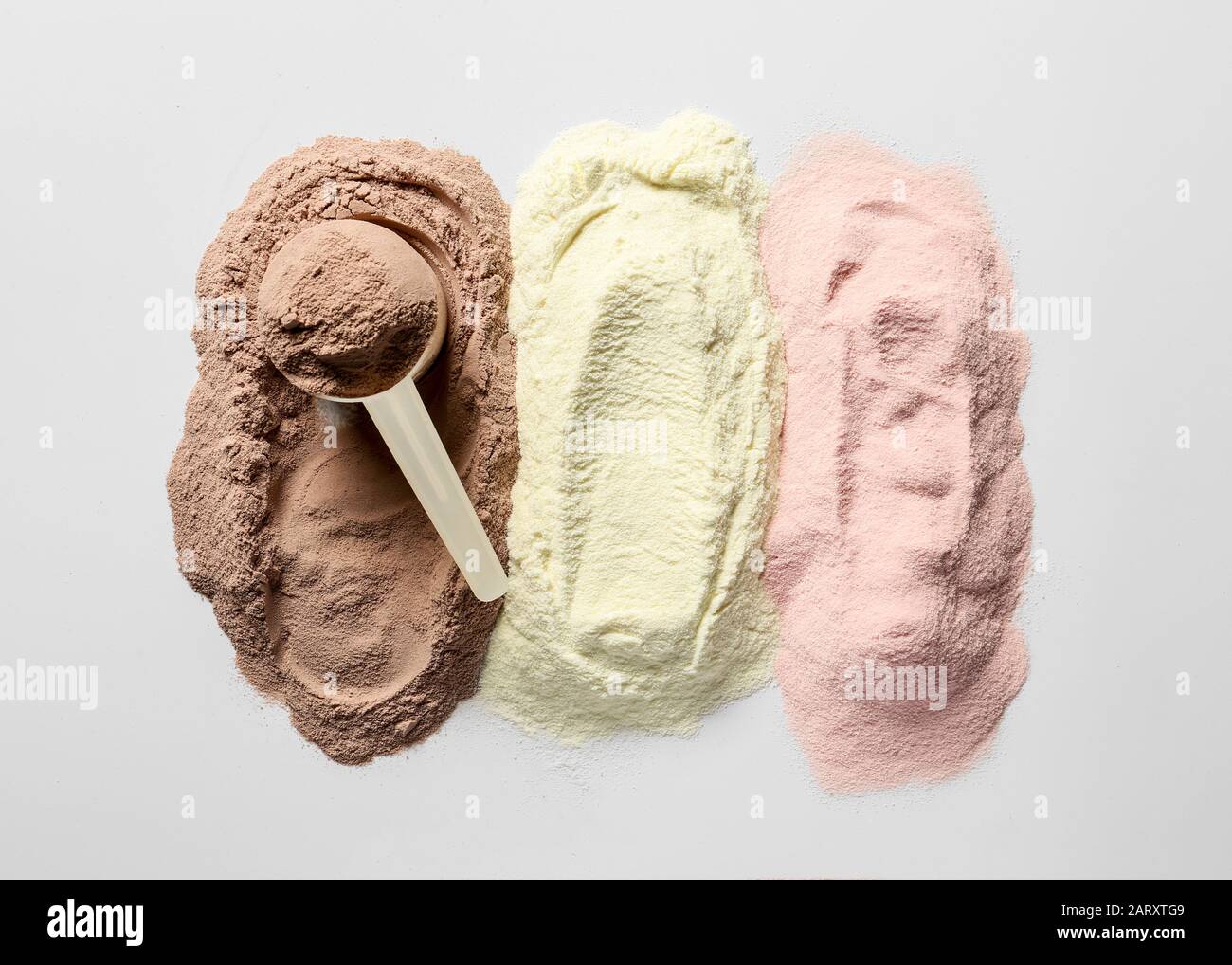 Different protein powders on white background Stock Photo - Alamy