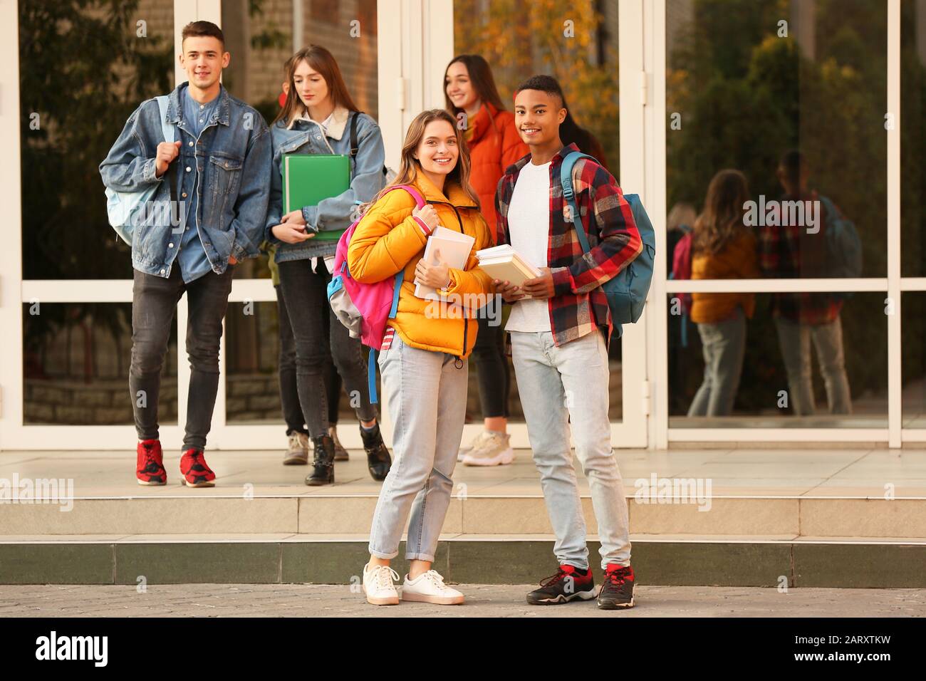 Group of teenage students near university Stock Photo - Alamy
