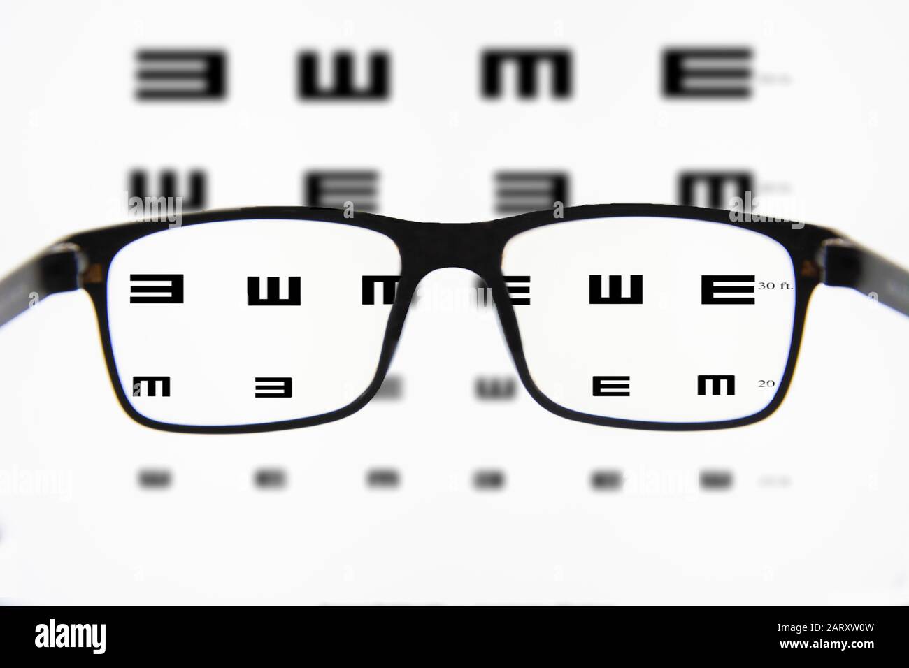 Glasses with eye chart Stock Photo - Alamy