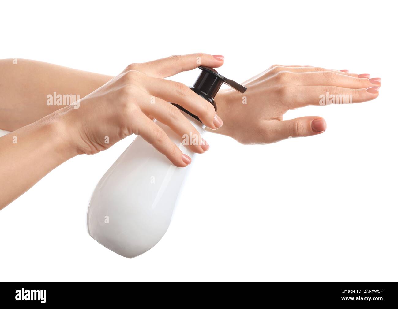 Young woman applying hand cream against white background Stock Photo ...