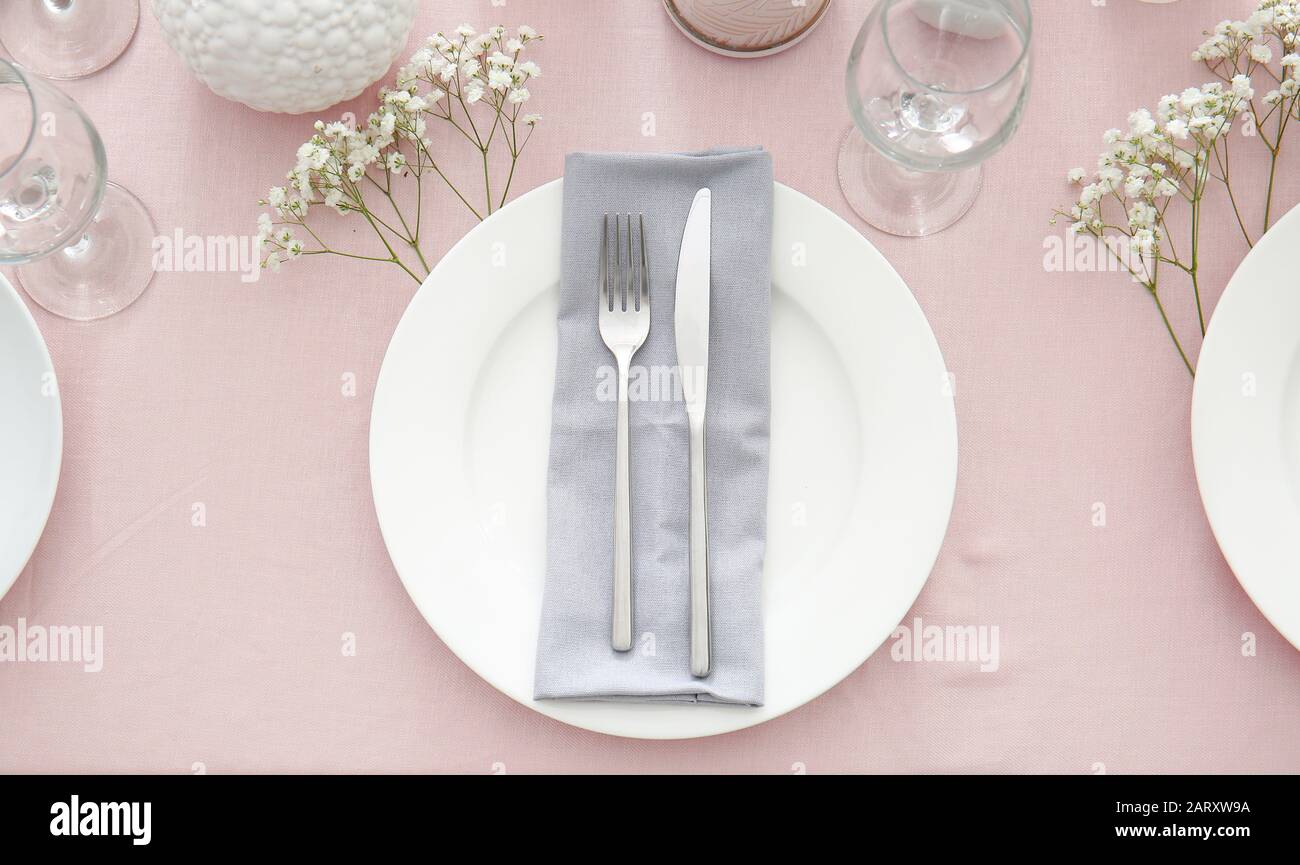 Beautiful table setting with floral decor Stock Photo - Alamy
