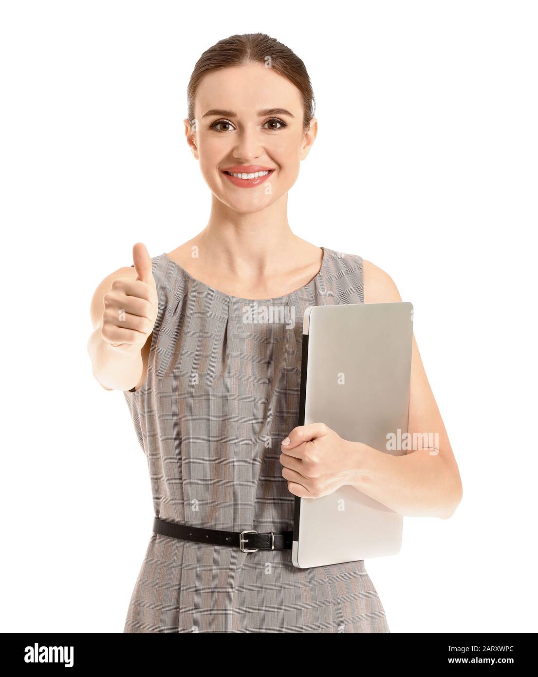 Female real estate agent showing thumb-up gesture on white background Stock Photo - Alamy