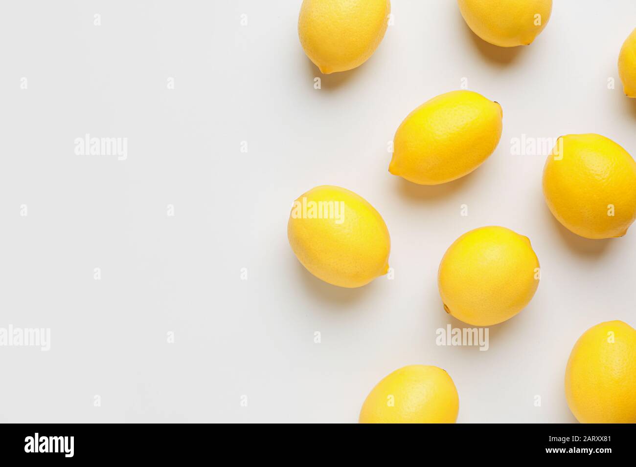 Ripe lemons on white background Stock Photo - Alamy