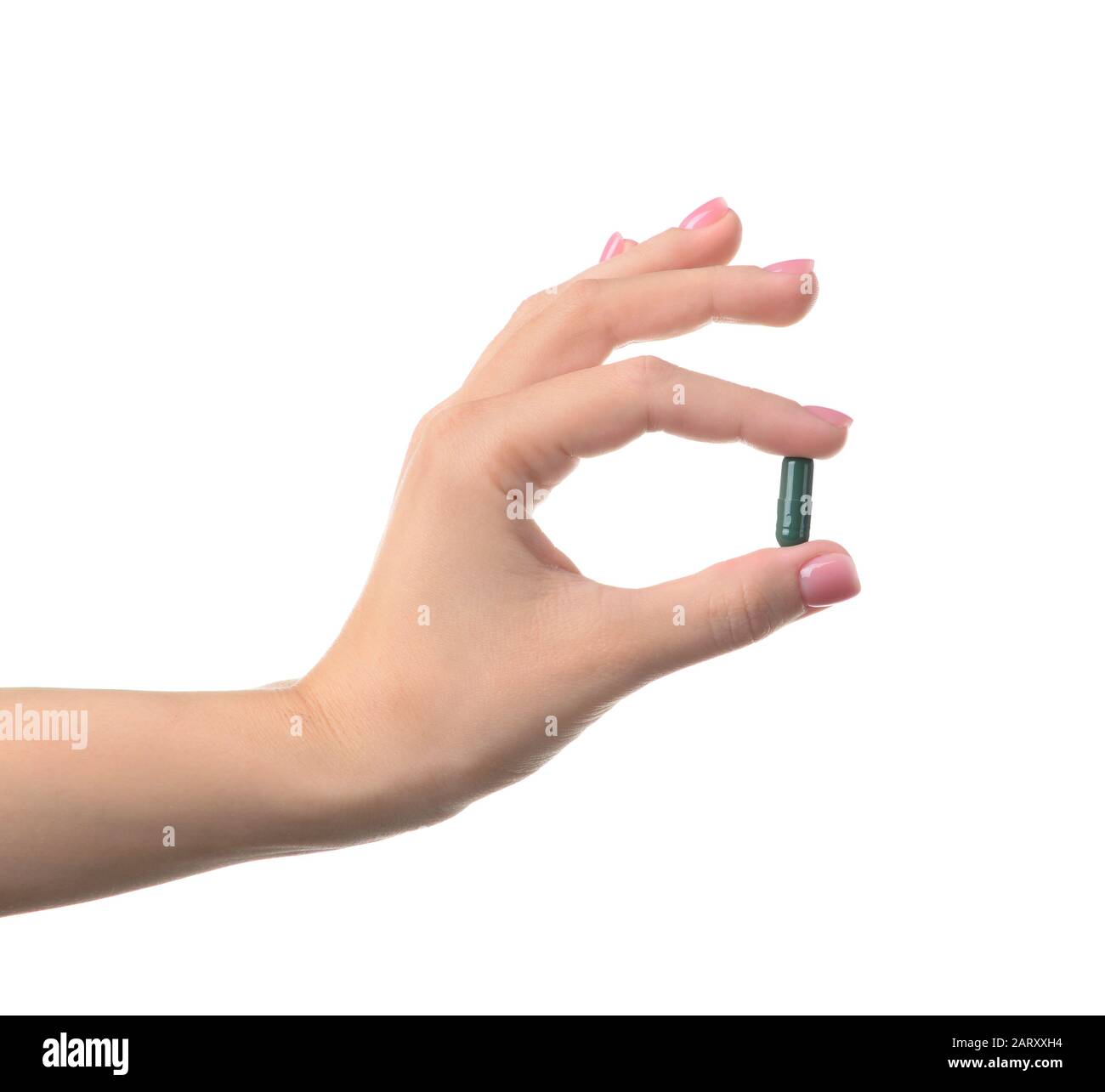Female hand with pill on white background Stock Photo - Alamy