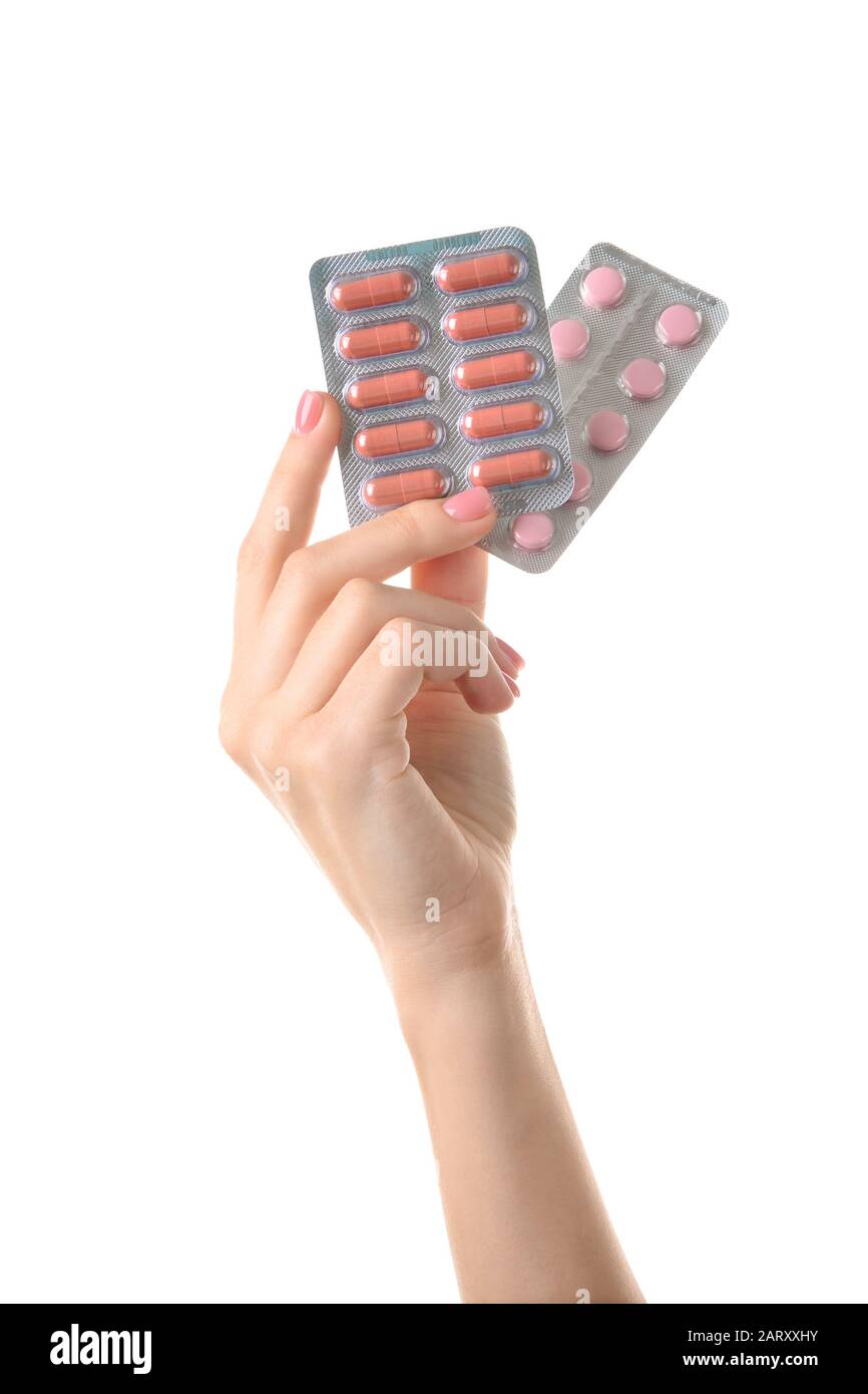 Female hand with pills on white background Stock Photo - Alamy