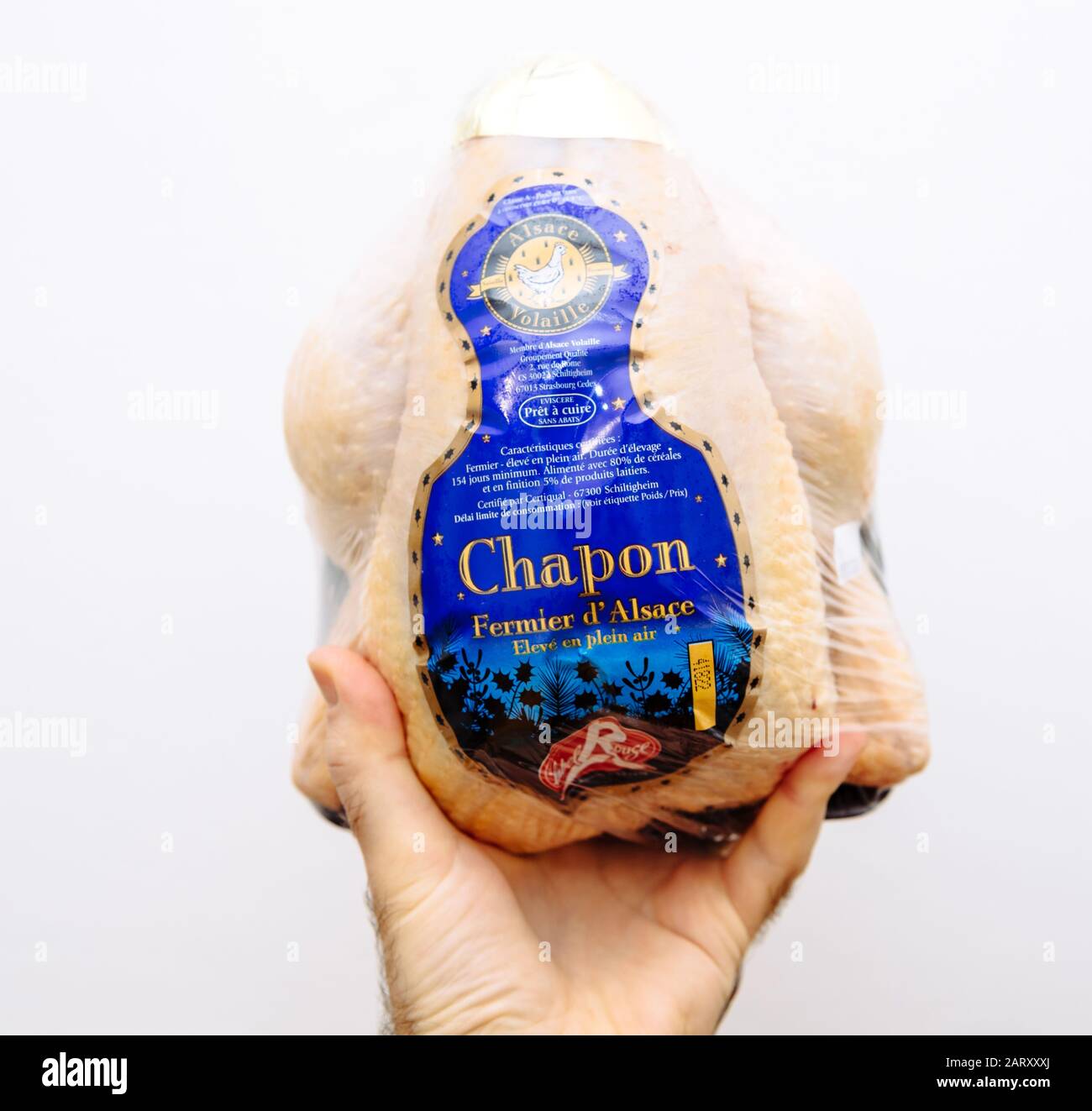 Paris, France - Dec 24, 2019: man hand holding against white background ...