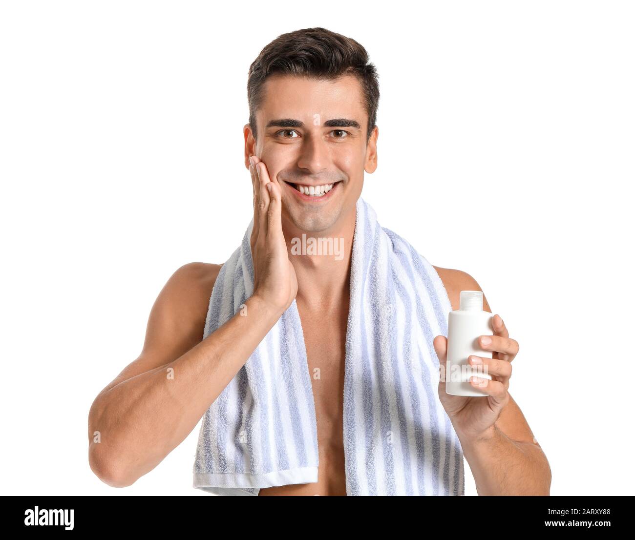 Handsome young man applying lotion after shaving on white background Stock Photo - Alamy