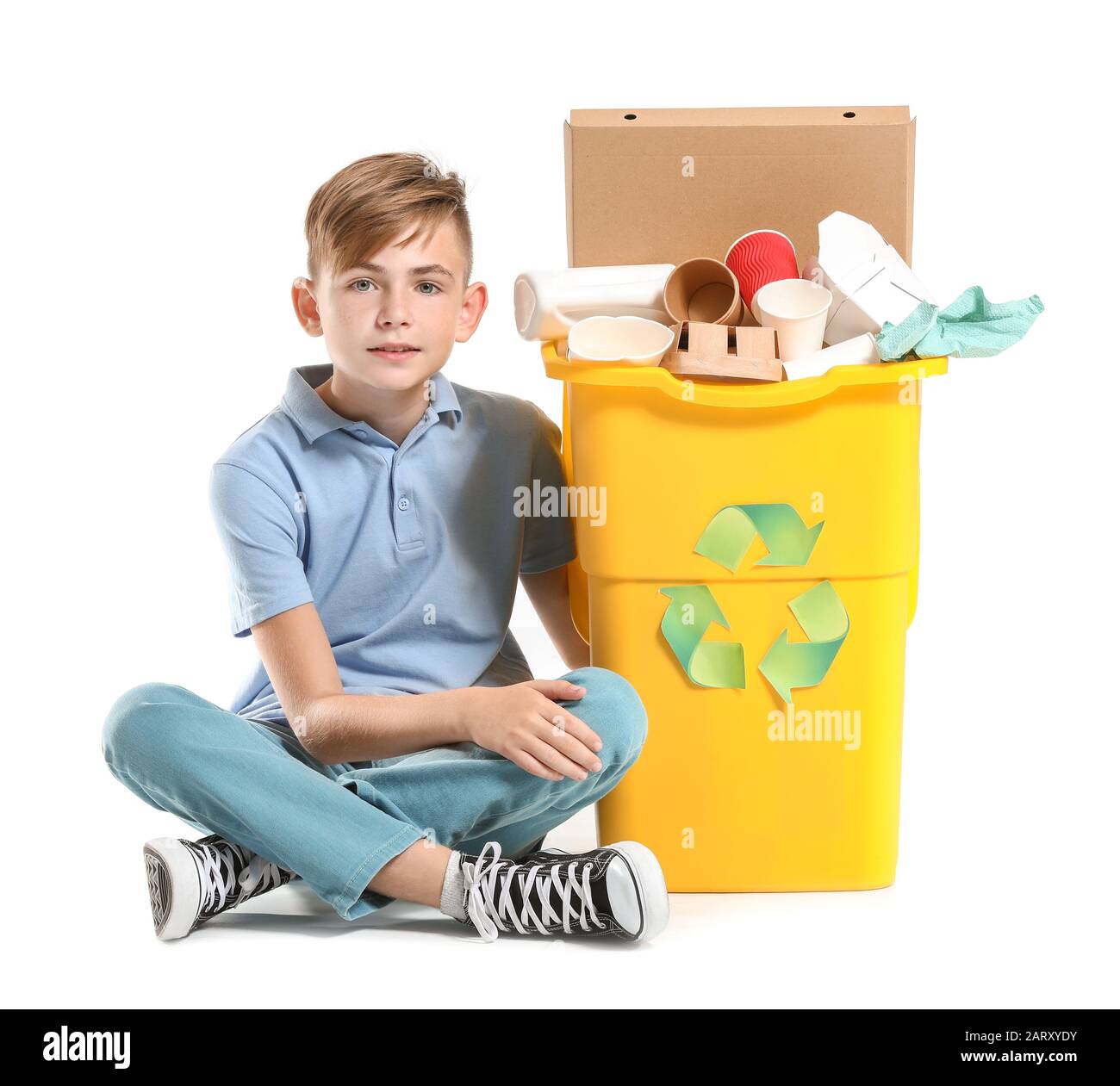 Little boy and container with trash on white background. Concept of ...