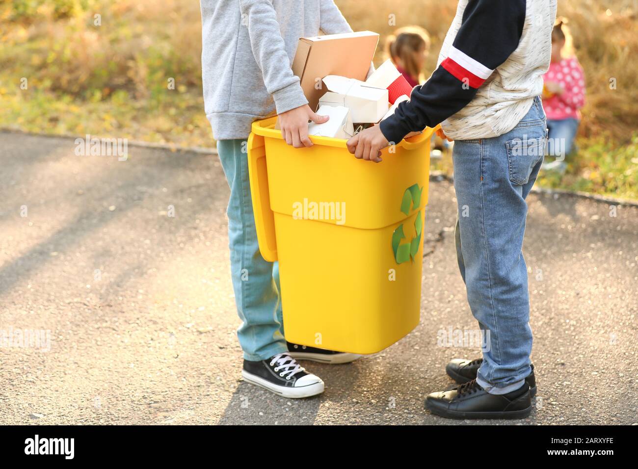 Little children collecting trash outdoors. Concept of recycling Stock ...