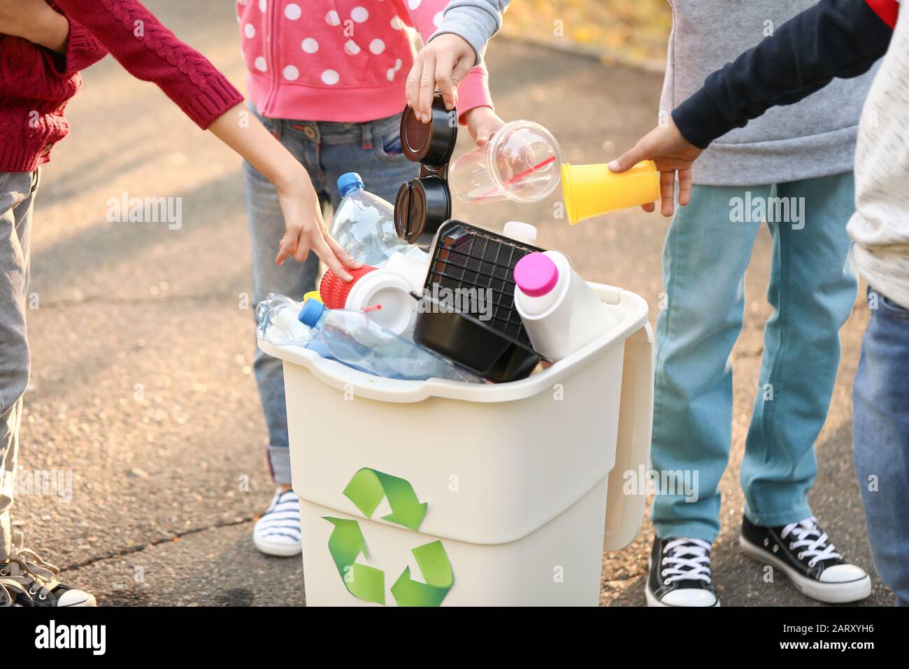 Little children collecting trash outdoors. Concept of recycling Stock ...