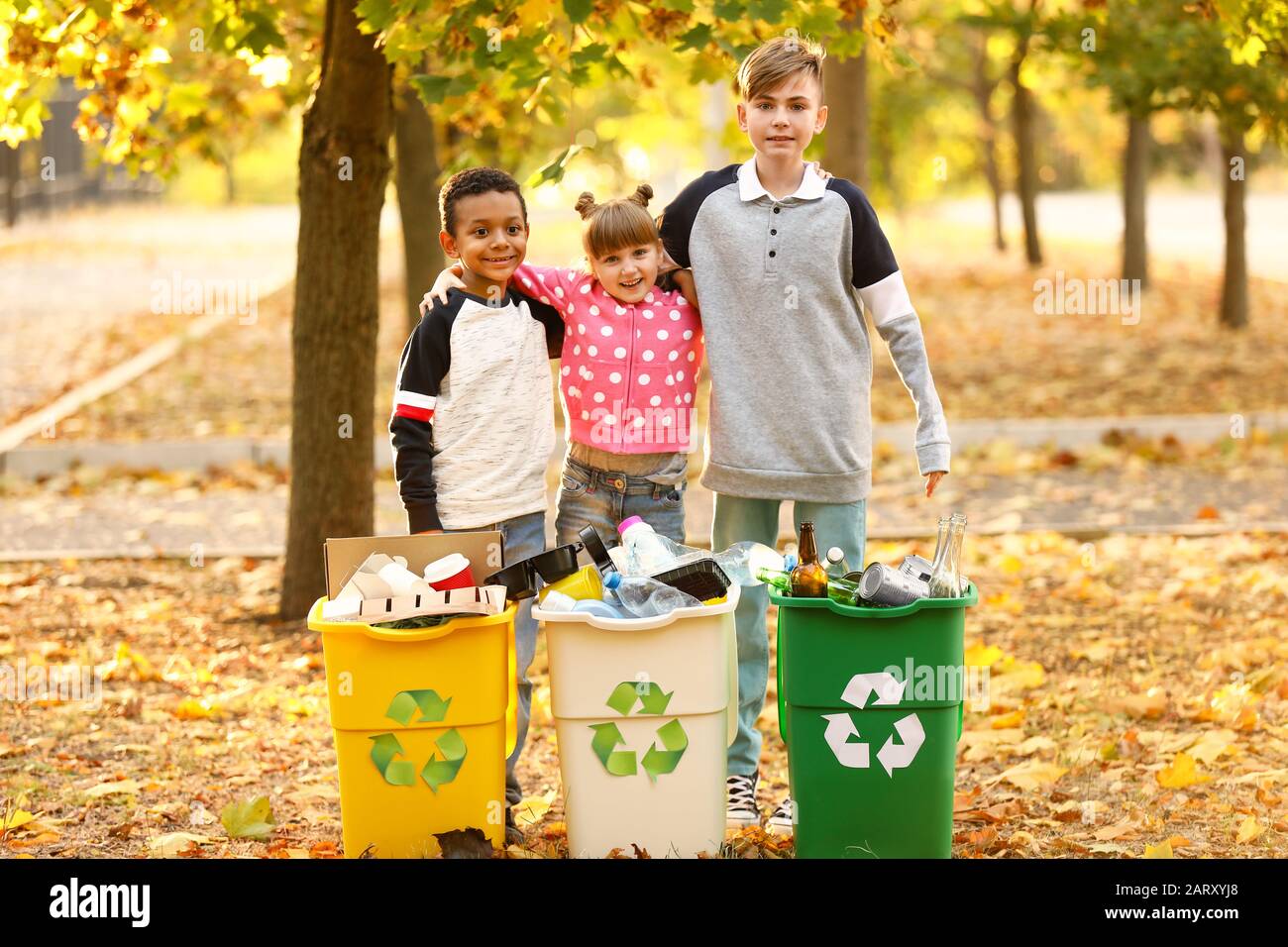 Little children collecting trash outdoors. Concept of recycling Stock ...
