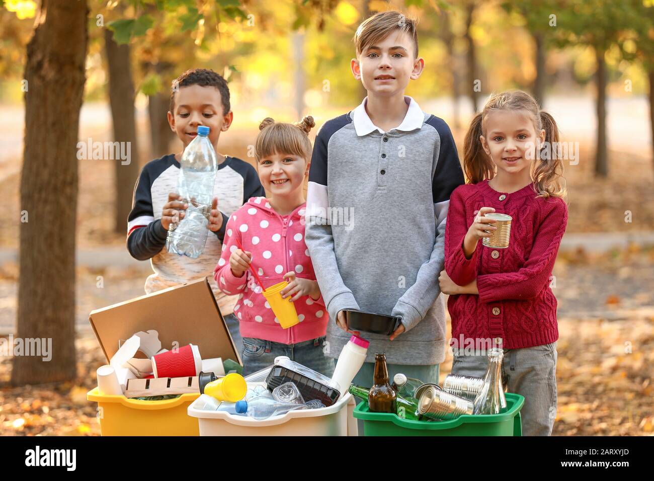 Little children collecting trash outdoors. Concept of recycling Stock ...