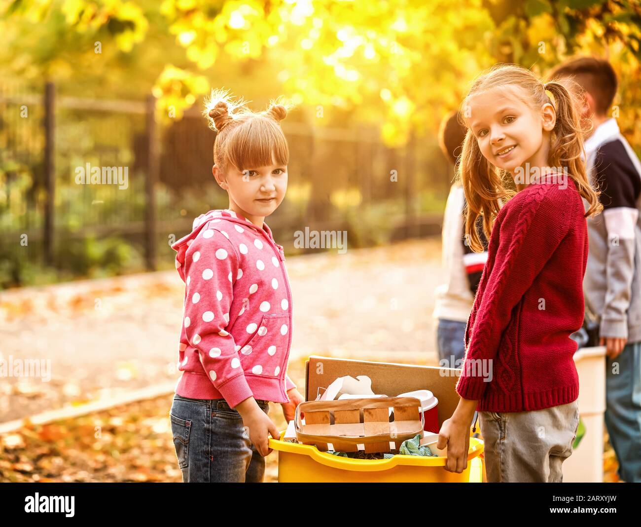 Little children collecting trash outdoors. Concept of recycling Stock ...