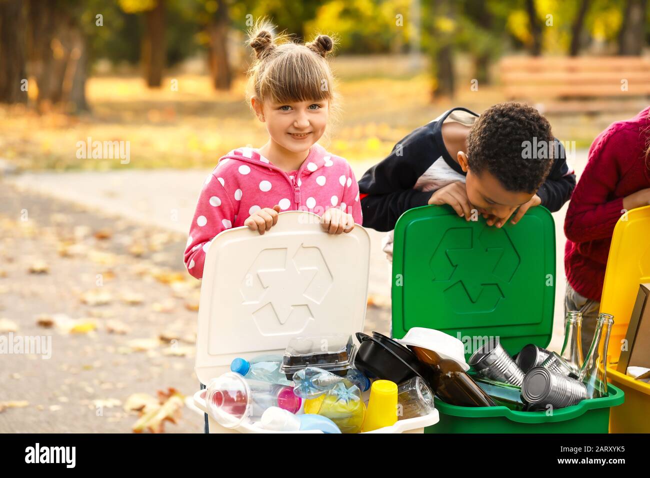 Little children collecting trash outdoors. Concept of recycling Stock ...