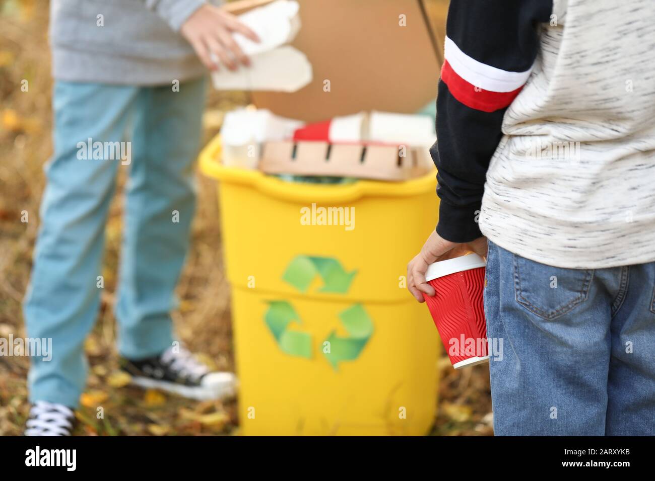 Little children collecting trash outdoors. Concept of recycling Stock ...
