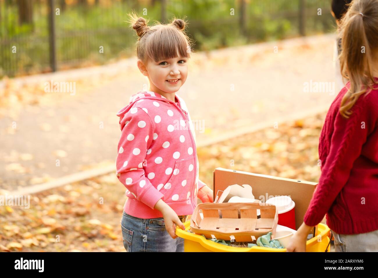Little children collecting trash outdoors. Concept of recycling Stock ...