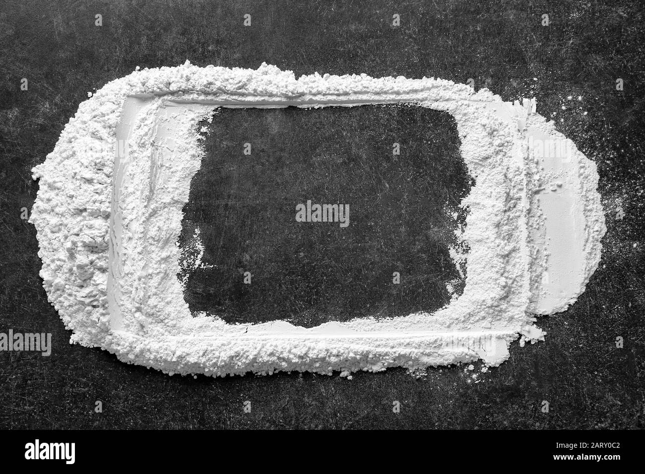 Frame made of flour on dark background Stock Photo - Alamy