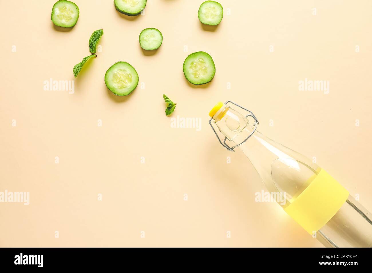 Bottle of cold cucumber water on light background Stock Photo - Alamy