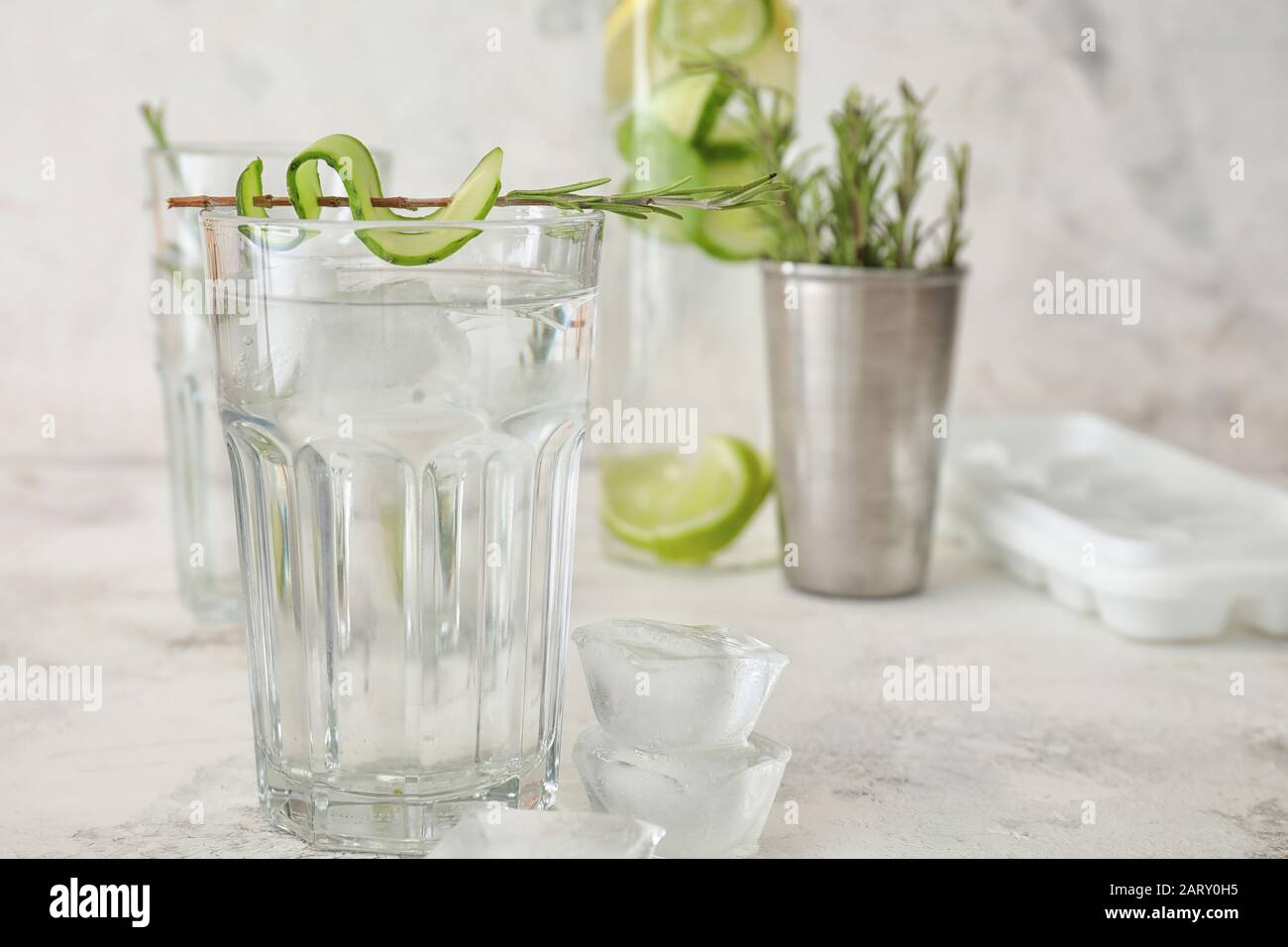 Glass of cold cucumber water on white background Stock Photo - Alamy