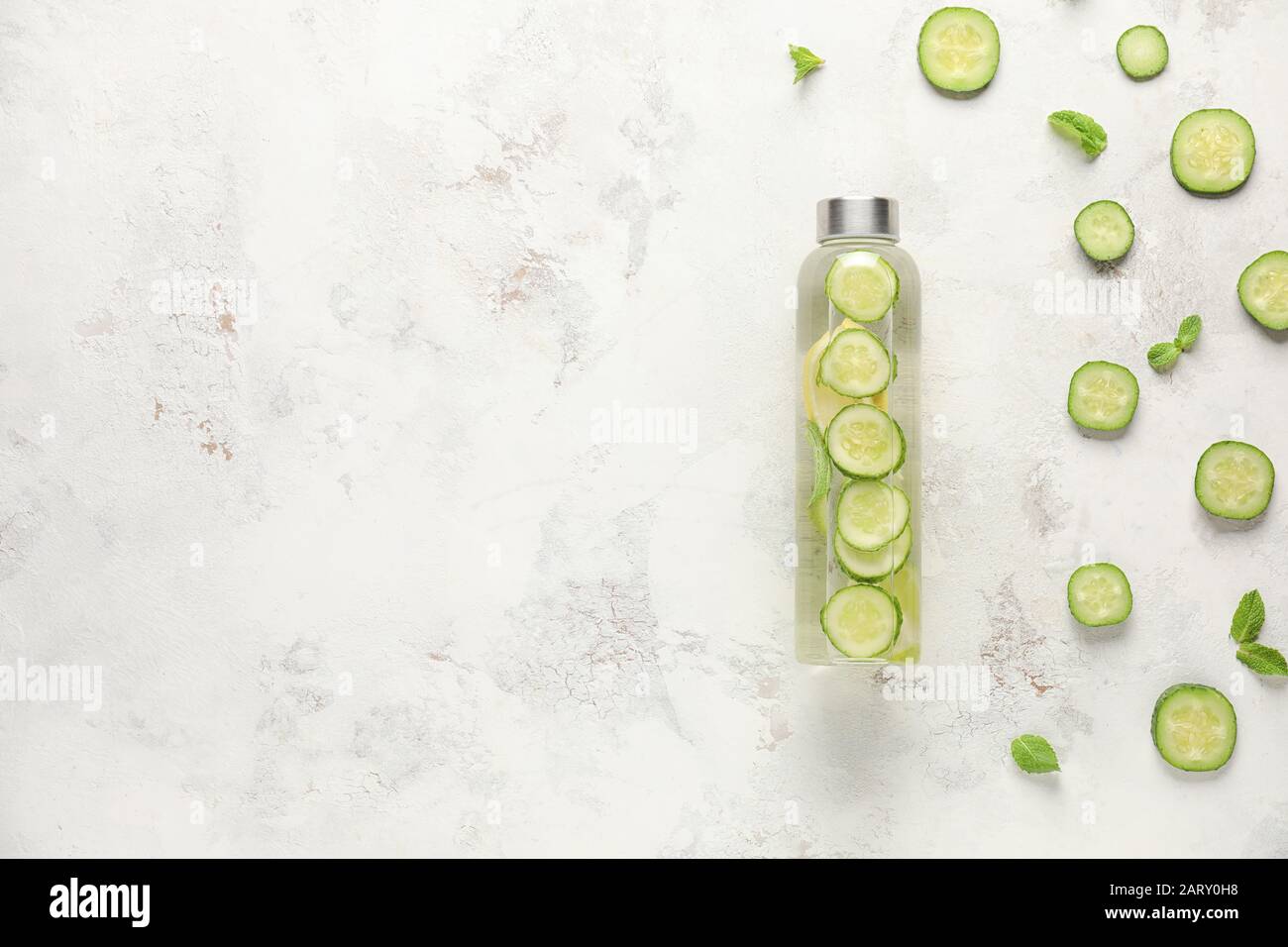 Bottle of cold cucumber water on white background Stock Photo - Alamy