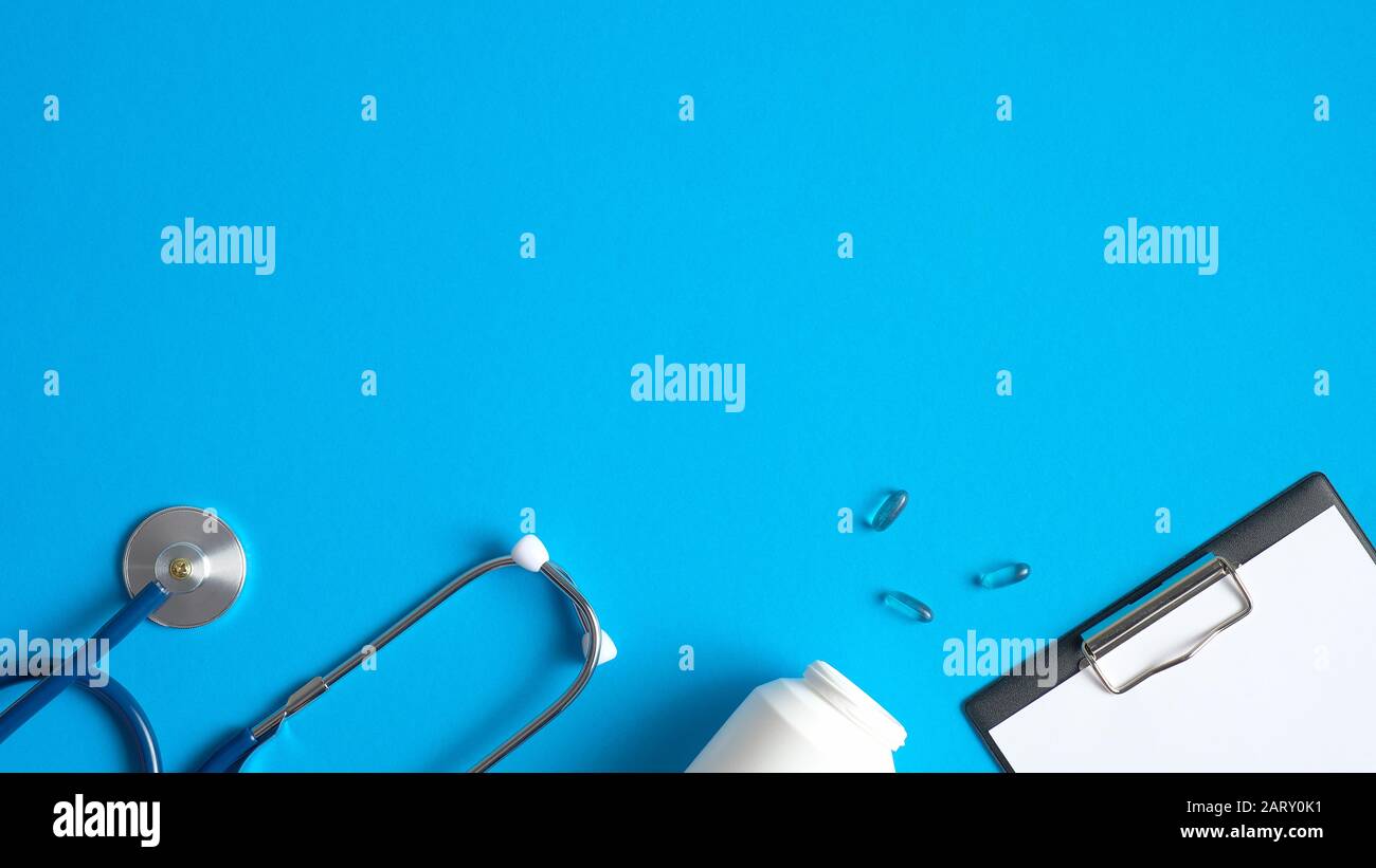 Pediatric doctor medical equipment on blue background. Top view table ...