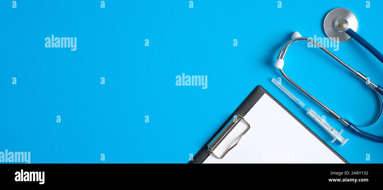 Pediatric equipment on blue background. Top view medical clipboard ...