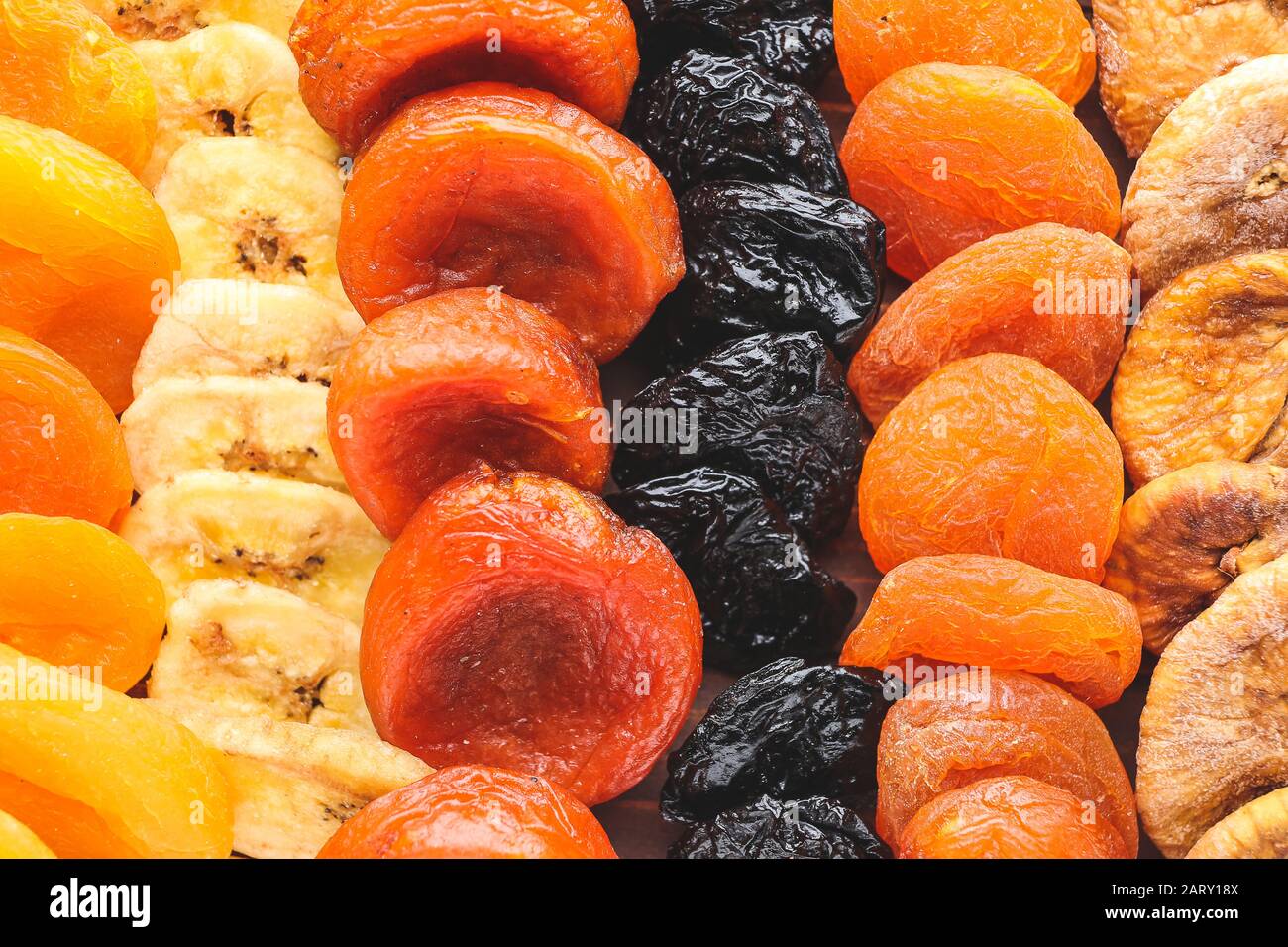 Different dried fruits as background Stock Photo - Alamy