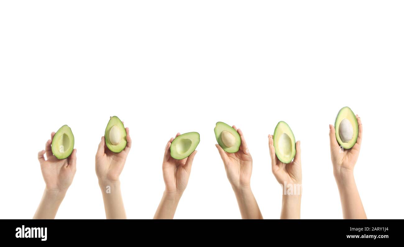 Hands holding half avocado fruit Cut Out Stock Images & Pictures - Alamy