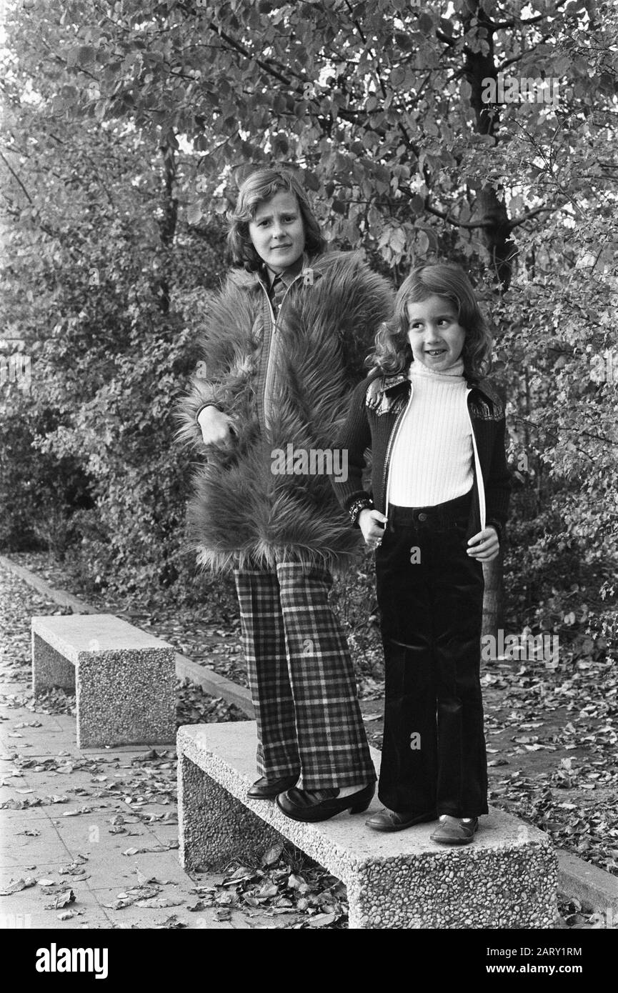 Children's fashion of the brand Mardy Two children present the clothing ...