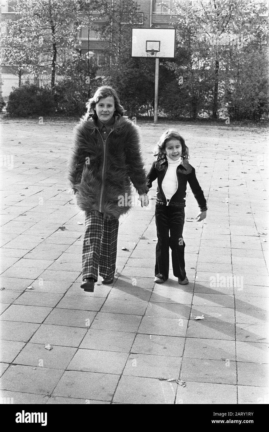 Children's fashion of the brand Mardy Two children present the clothing ...