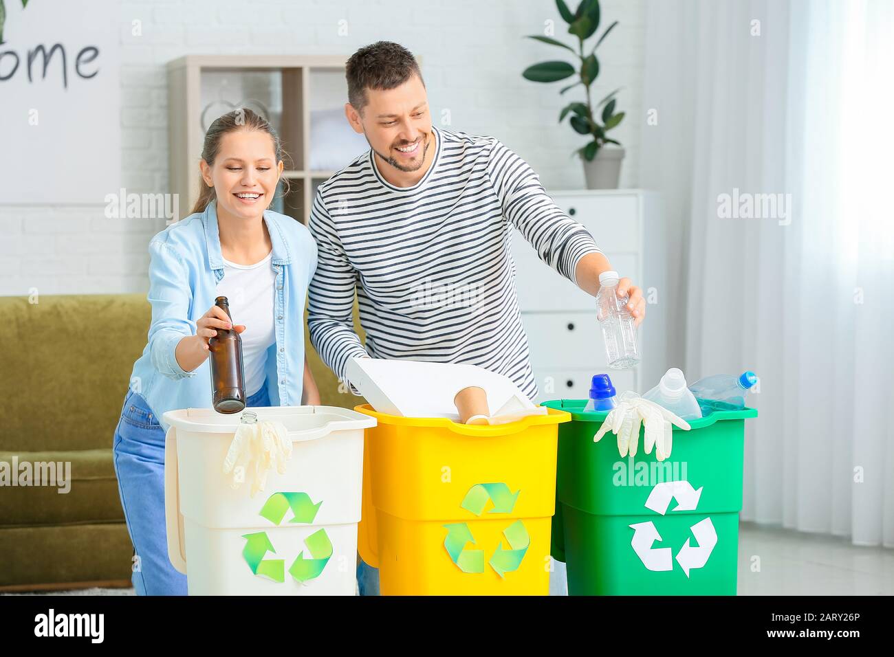 Couple sorting garbage home hi-res stock photography and images - Alamy