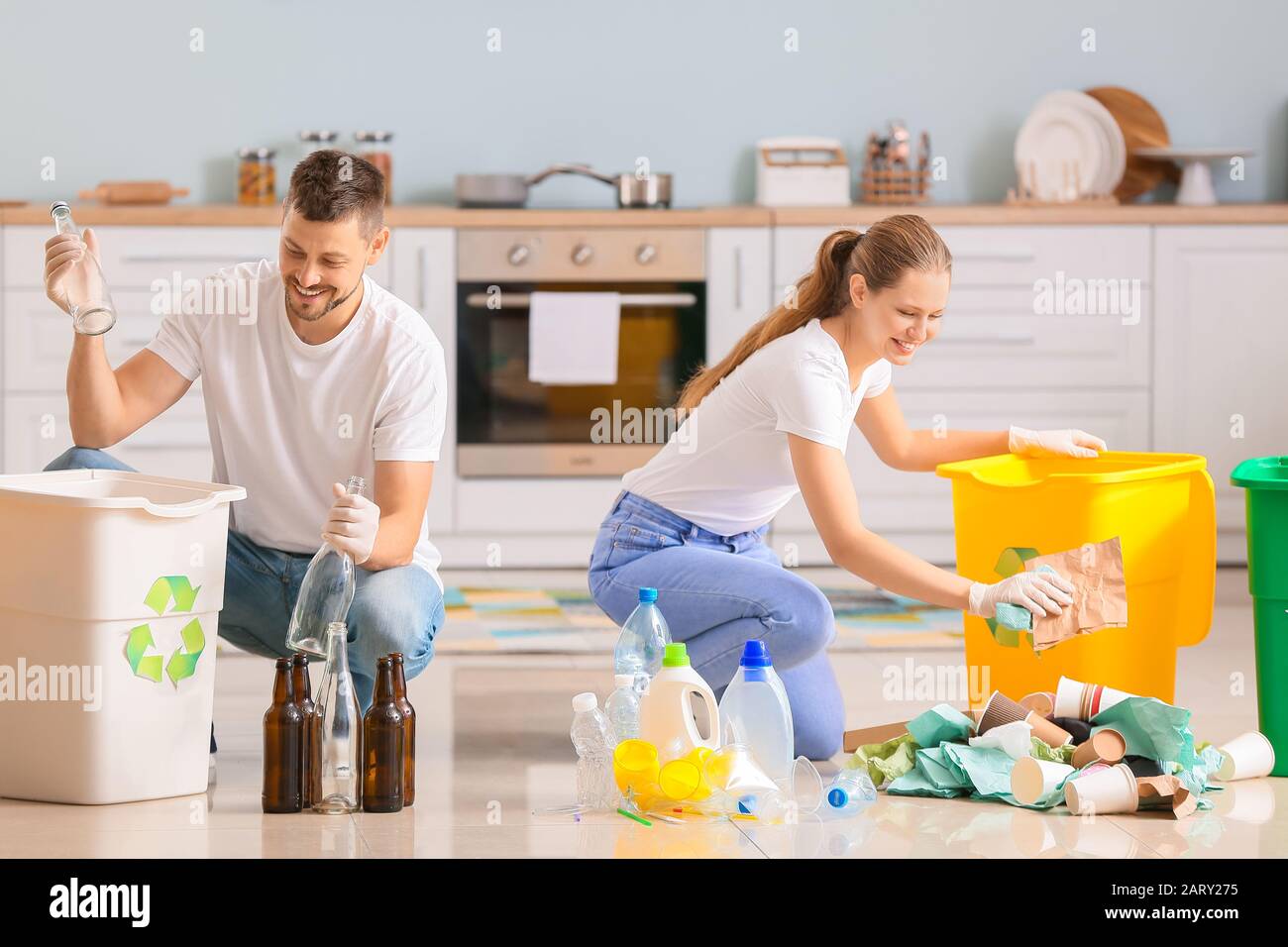 Couple sorting garbage home hi-res stock photography and images - Alamy