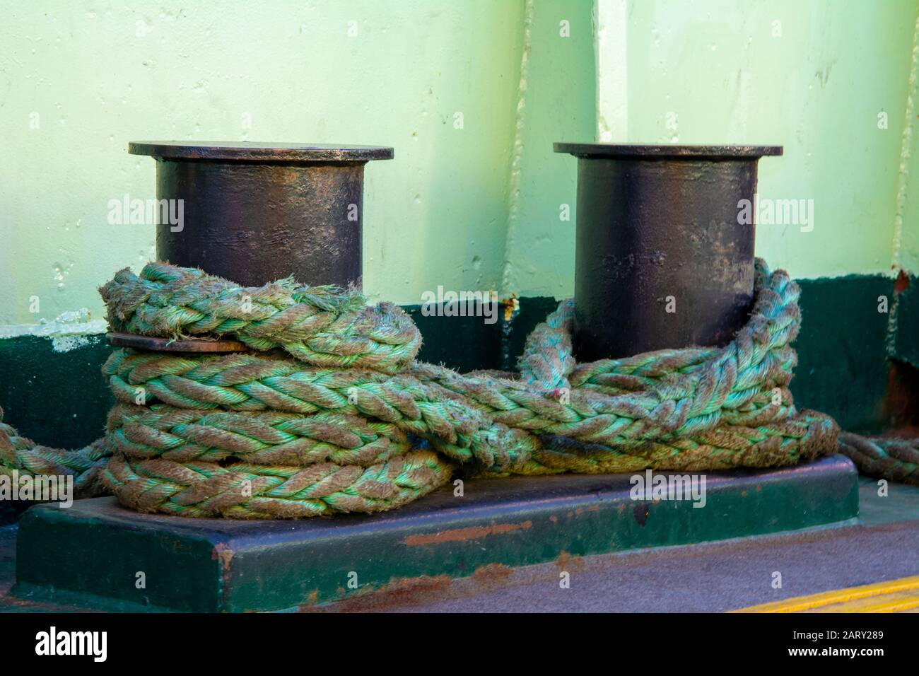 Bollards and rope Stock Photo - Alamy
