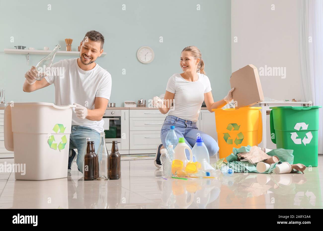 Couple sorting garbage home hi-res stock photography and images - Alamy