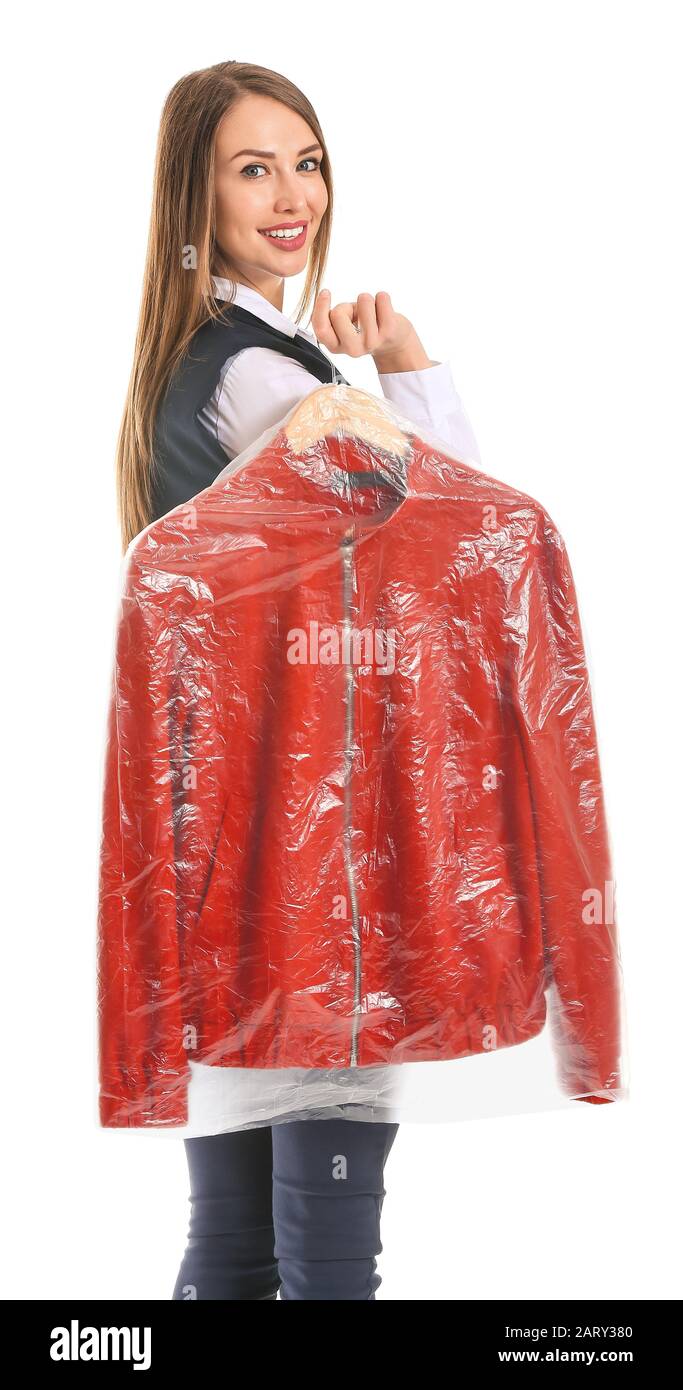 Female worker of modern dry-cleaner's with clothes on white background ...