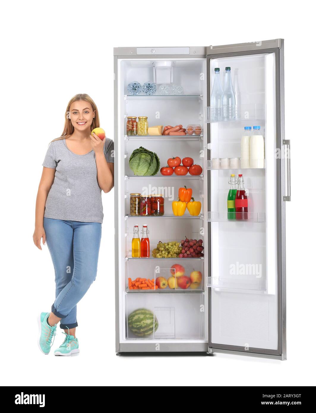 Woman and fridge Cut Out Stock Images & Pictures - Alamy