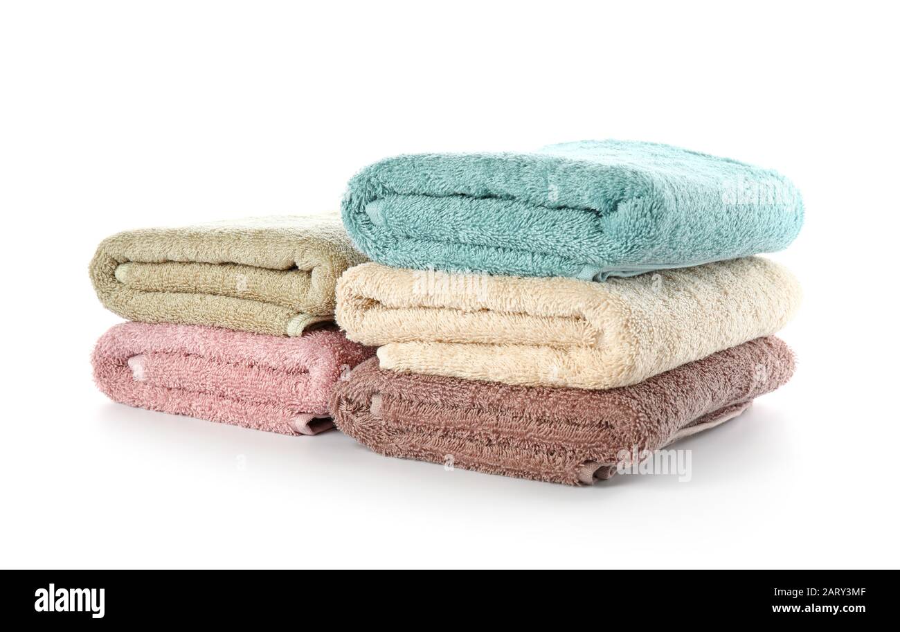 Stacks of clean towels on white background Stock Photo - Alamy