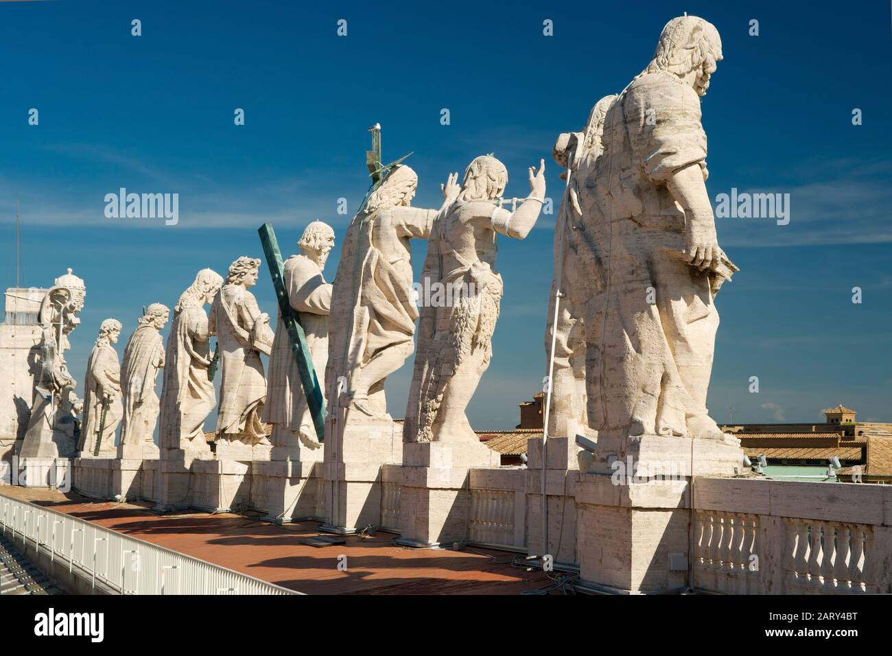 Statues of Christ and the apostles on the roof of St. Peter`s basilica ...