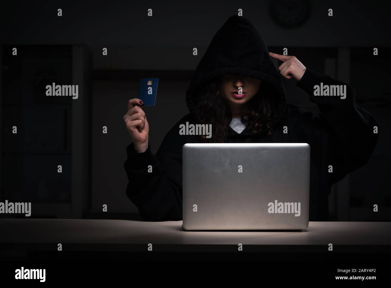 The female hacker hacking security firewall late in office Stock Photo ...