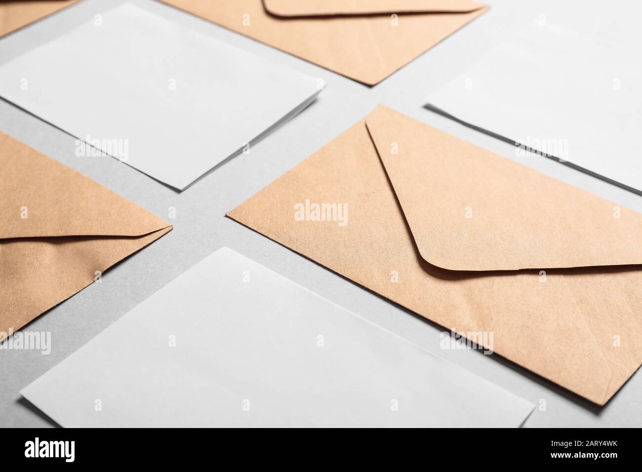 Mockups of invitations with envelopes on light background Stock Photo ...
