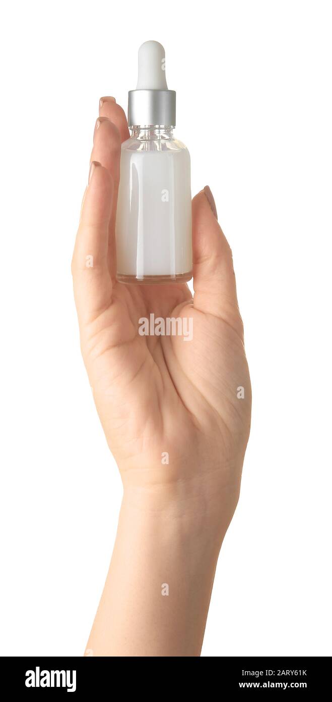 Female hand with cosmetic product in bottle on white background Stock ...