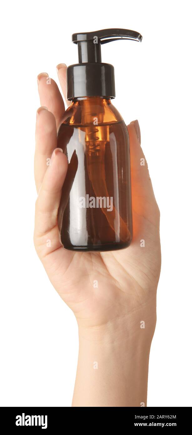Female hand with cosmetic product in bottle on white background Stock ...