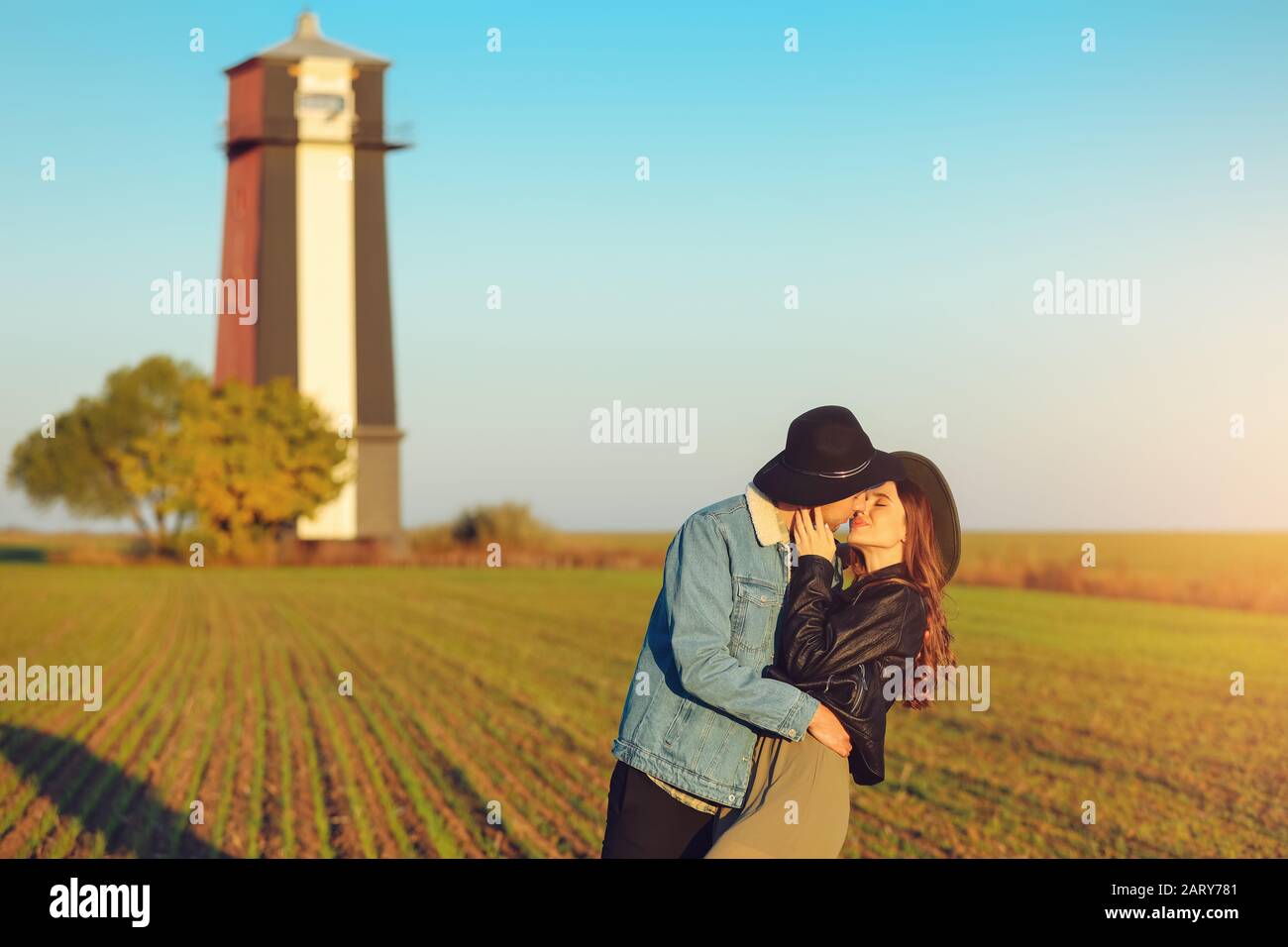 Happy young couple in countryside Stock Photo - Alamy